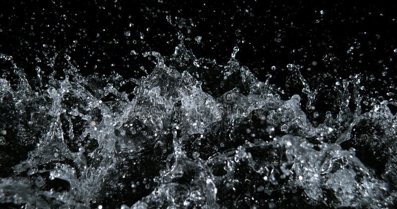 Water Exploding and Splashing Against Black Background Stock Photo ...