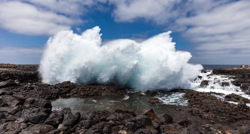 Water explosion on rocks stock photo. Image of explostion - 73655374