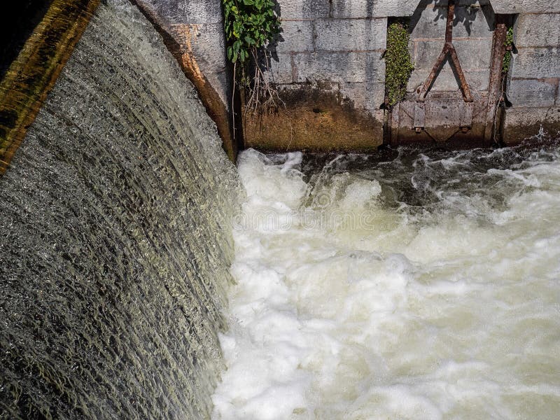 Water Falling from a Dam Creating Splash Stock Image - Image of force ...