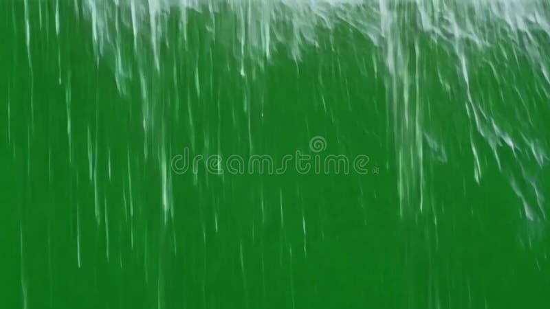 Water Falling Down Creating Abstract Shapes on Green Background Stock ...