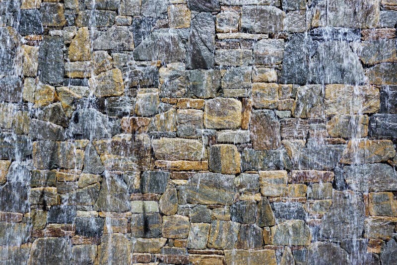 Water Falling Down a Stone Wall Stock Image - Image of feature, motion ...
