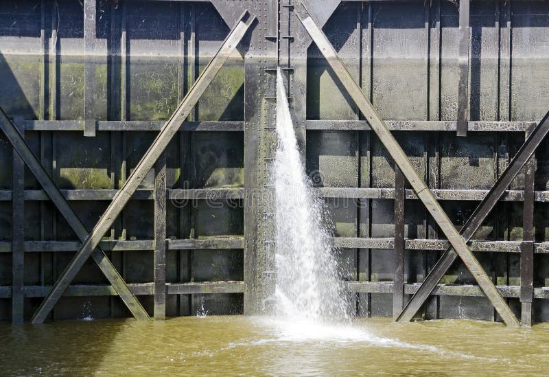 Water Falling through a Gap of an Old Sluice Gate Stock Photo - Image ...