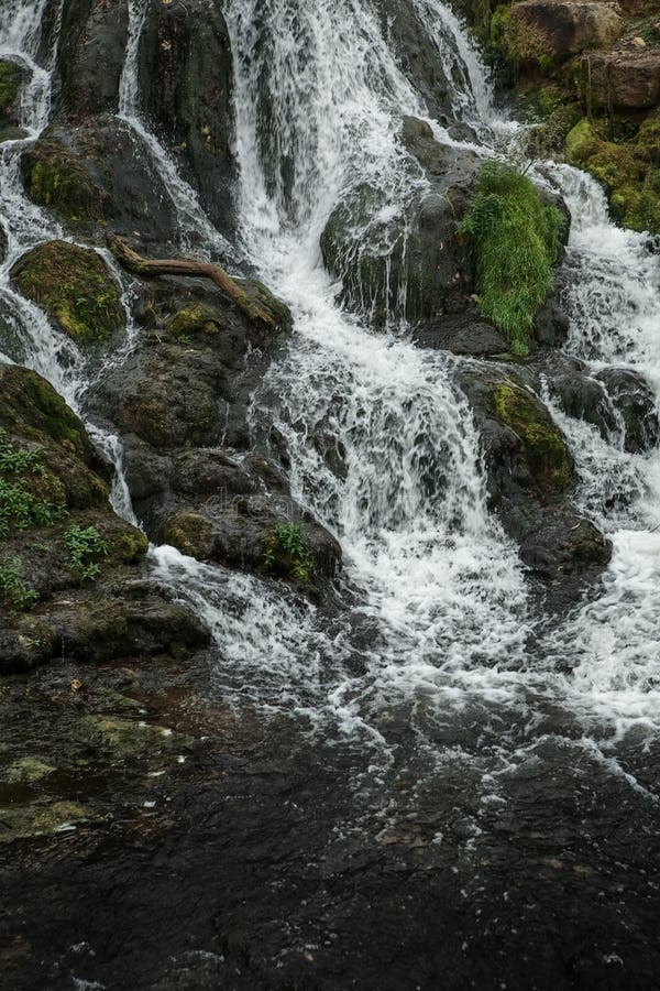 Water falling over rocks stock image. Image of beauty - 35909191