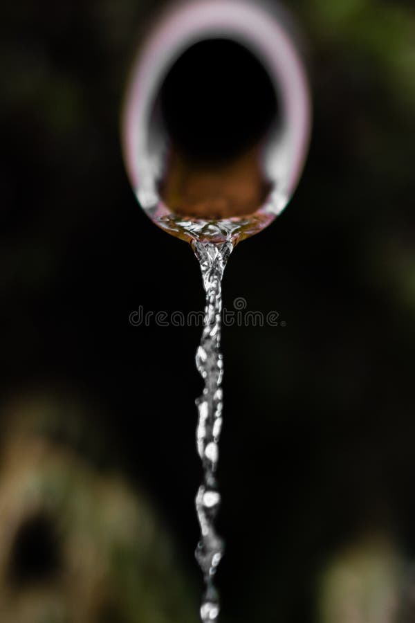 Water Falling from a Piece of Bamboo Stock Photo - Image of pretty ...