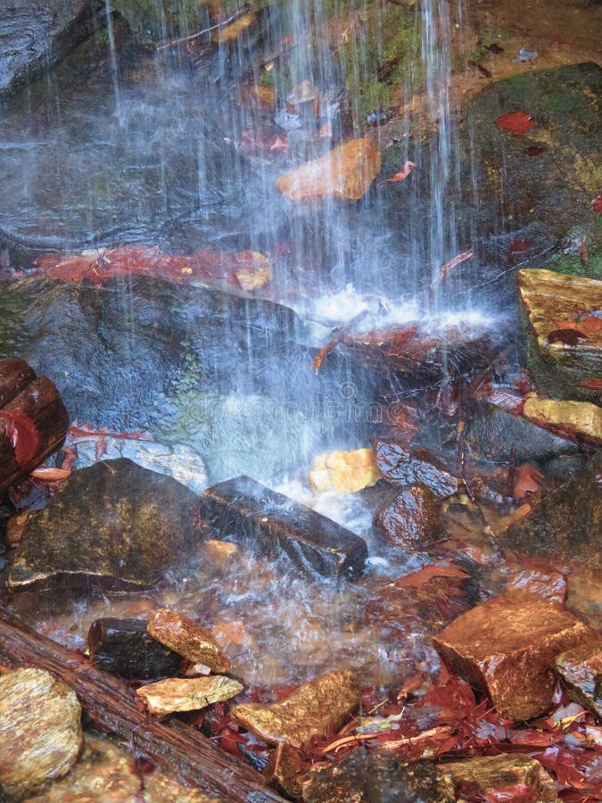 Water Falling on Red, Gray, and Orange Rectangular Rocks Stock Photo ...