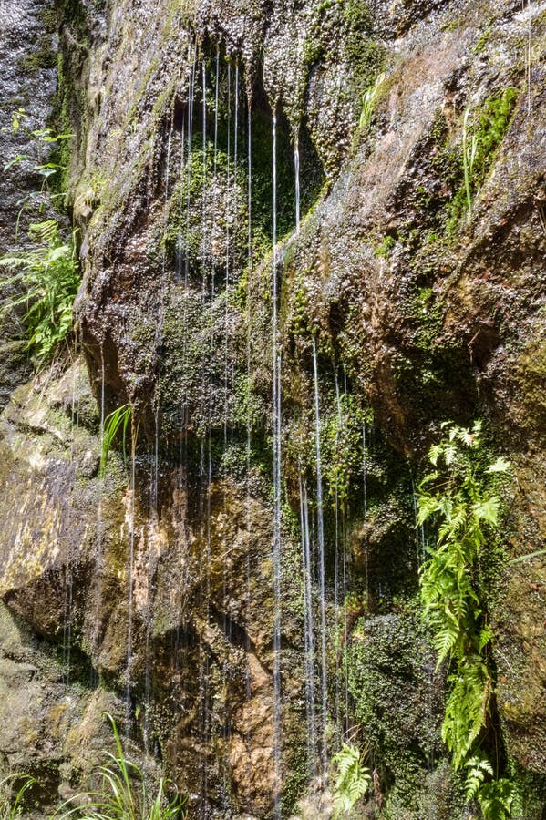 Water Falling through a Rock Formation Stock Photo - Image of hill ...