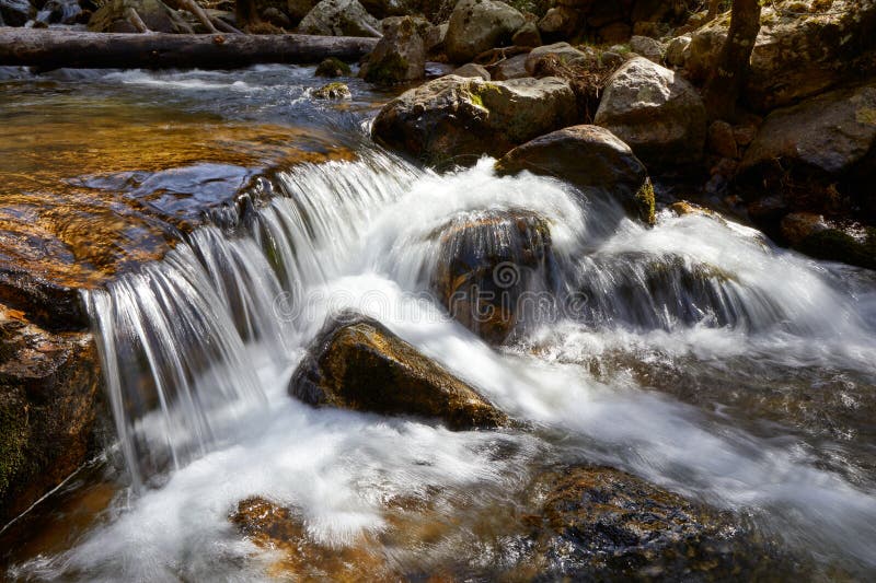 Water Falling on Rocks in a Small River Waterfall Stock Photo - Image ...