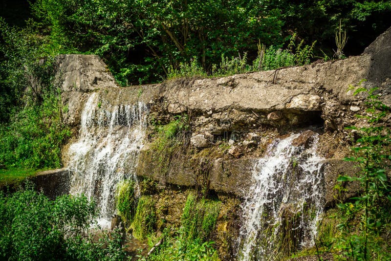 Water falling on rocks stock photo. Image of mountain - 189371854