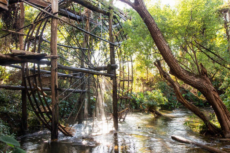 Water Falling from the Water Wheel into the Forest. Stock Image - Image ...
