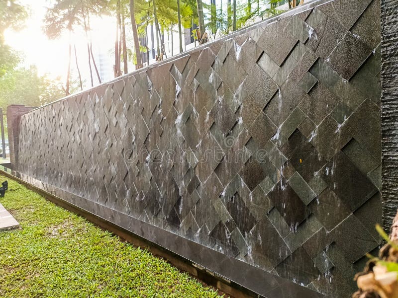 Water Falls Along the Stone Wall for Modern Pond Stock Photo - Image of ...