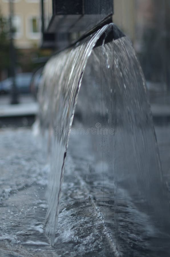 Water Falling Down in a Town Fountain Stock Image - Image of falls ...