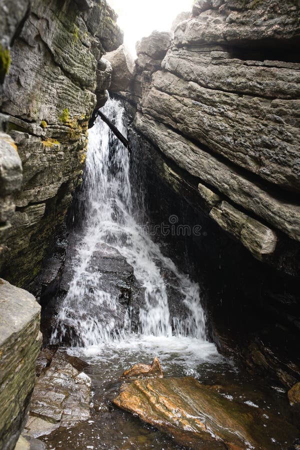 Waterfall between Two Rock Slabs Stock Photo - Image of rock, natural ...