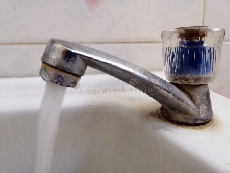The Water Faucet is Left Open. Water Flows Out of the Tap, Water in the ...