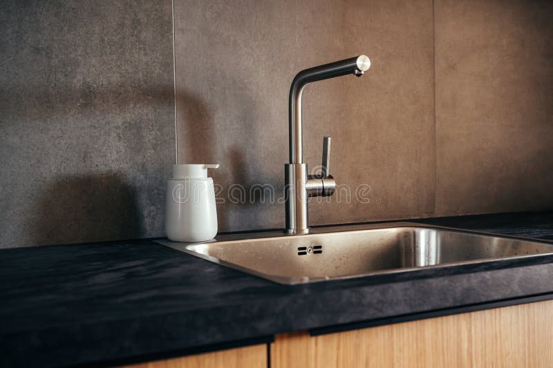 Water Faucet and Metallic Sink in Modern Sleek Kitchen Stock Image ...