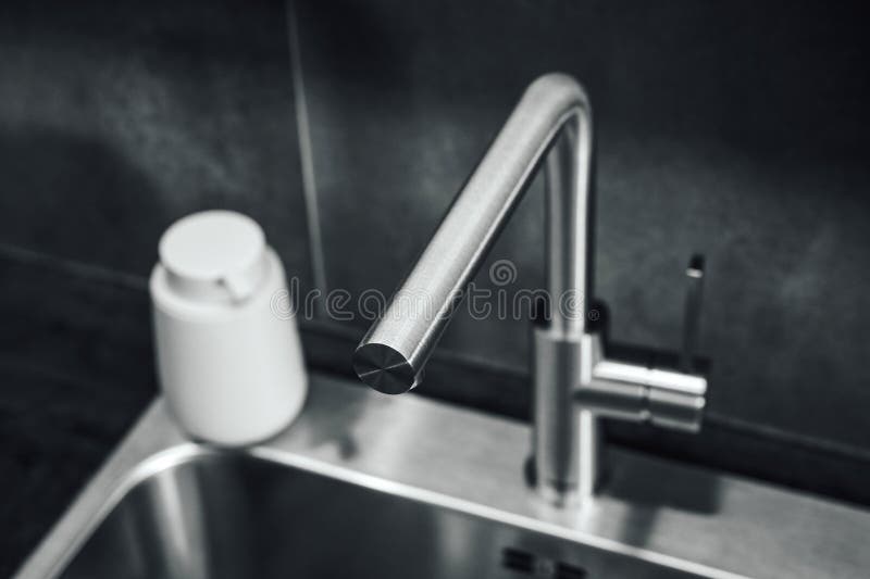 Water Faucet and Metallic Sink in Modern Sleek Kitchen Stock Photo ...