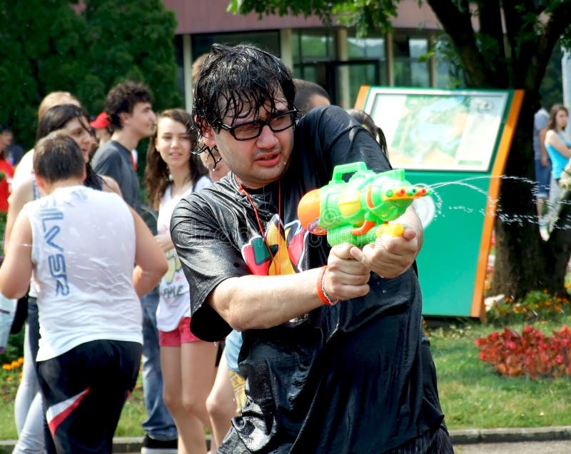 Water fight editorial image. Image of drops, people, herastrau - 19956335