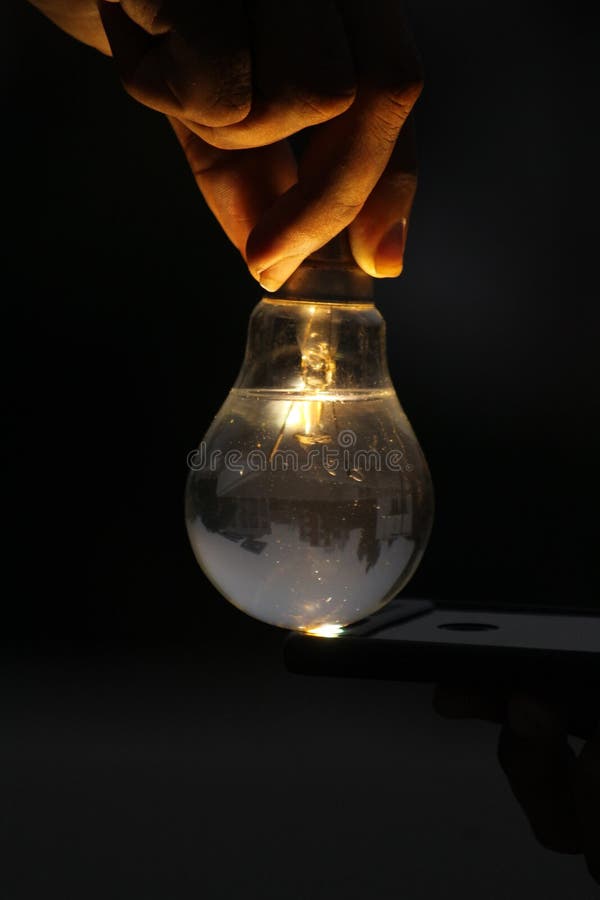 Water Fill into Filament Bulb and Glow Yellow Light Stock Image - Image ...