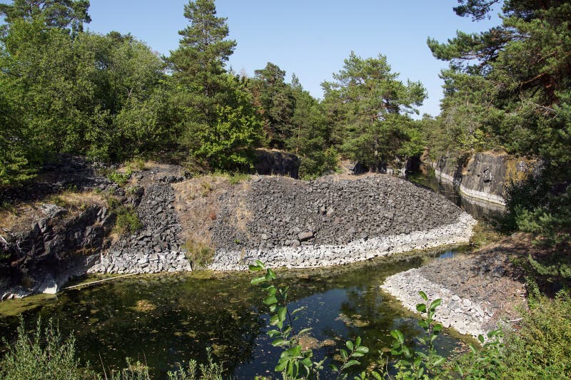A Water-filled Old Mine in the Forest Stock Photo - Image of rock ...