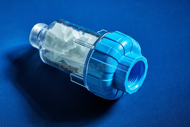 Water Filter with a Crumb of Salt Crystals on a Blue Background Stock ...