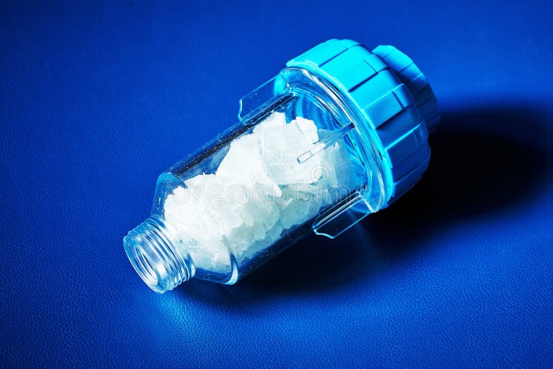 Water Filter with a Crumb of Salt Crystals on a Blue Background Stock ...