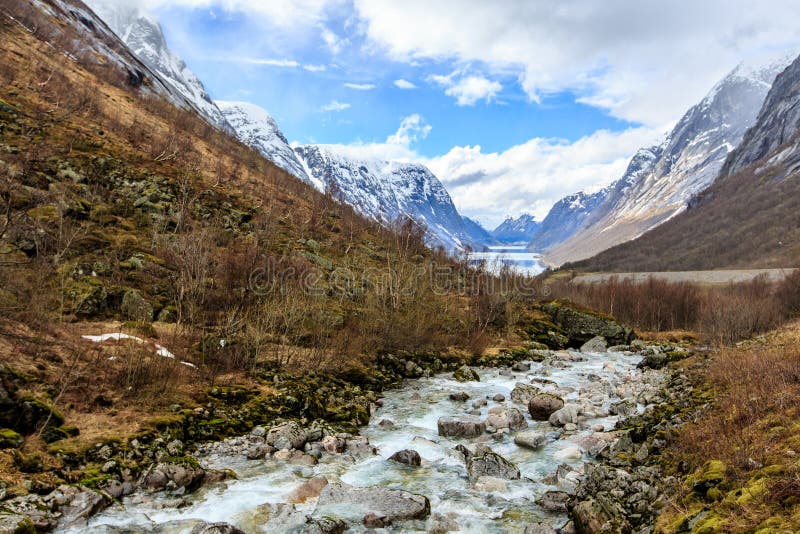 Water Flow Down From River To Lake With Snow Cap Mountain Background ...