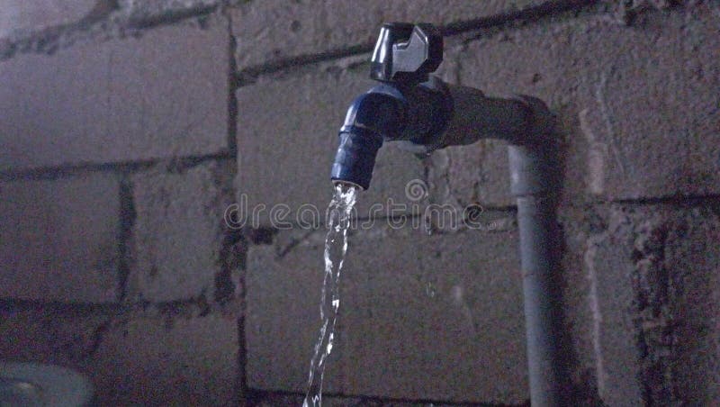 Water flow from the faucet stock photo. Image of flow - 264188024