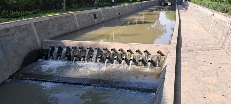Water flow in mini dam stock image. Image of garden - 256774545