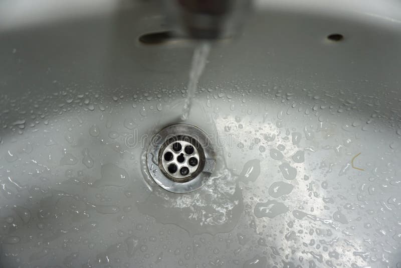 Water Flow Out through Drain Outlet Stock Photo - Image of white, iron ...