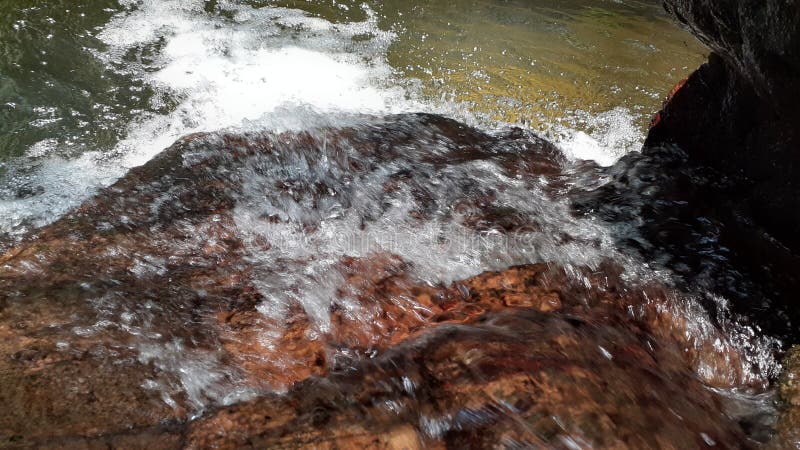 Water flow on rock stock photo. Image of water, flow - 265752524
