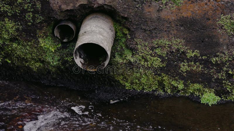 Aged PVC Pipes Drip Water Onto the Concrete Surface Stock Video - Video ...