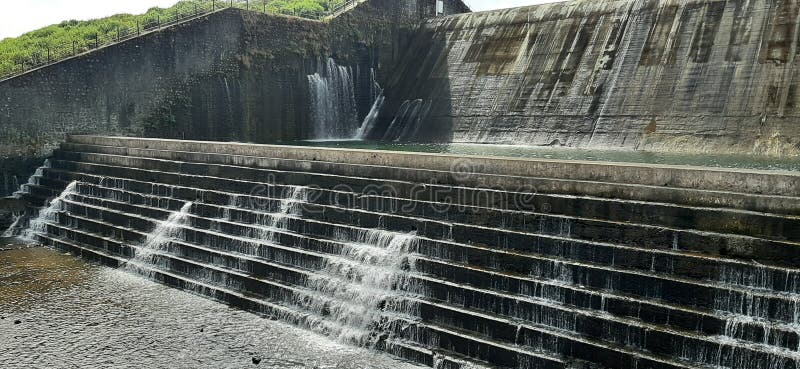 Water flowing on Dam steps stock photo. Image of water - 259964664