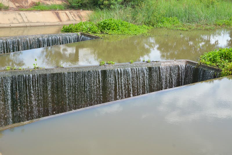 Water flowing from dam stock photo. Image of energy - 183552080