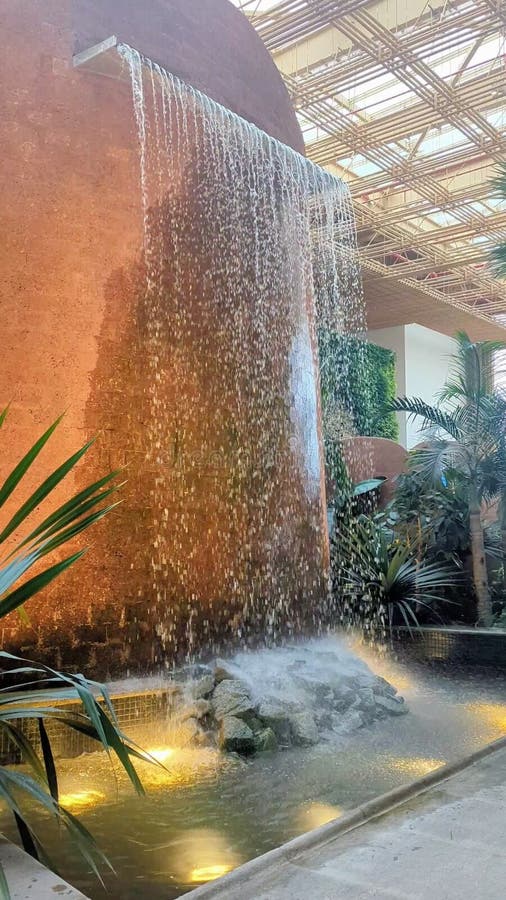 Water Flowing into the Decorative Pool from an Artificial Waterfall ...
