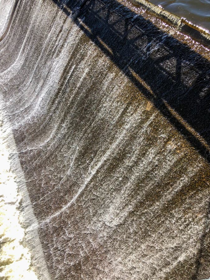 Water flowing down dam stock image. Image of waterfall - 180451669