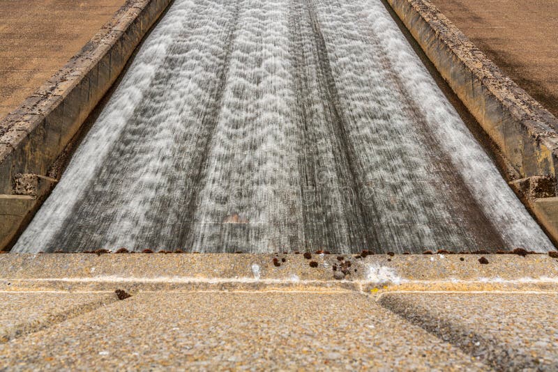 Water flowing down a dam stock photo. Image of flow - 226961668