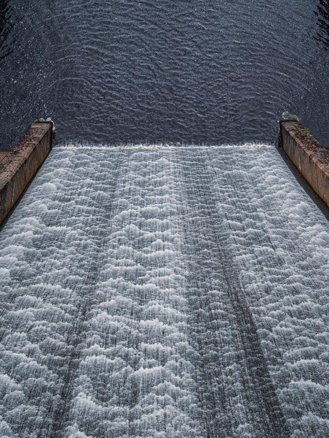 Water flowing down a dam stock image. Image of barrier - 170076953