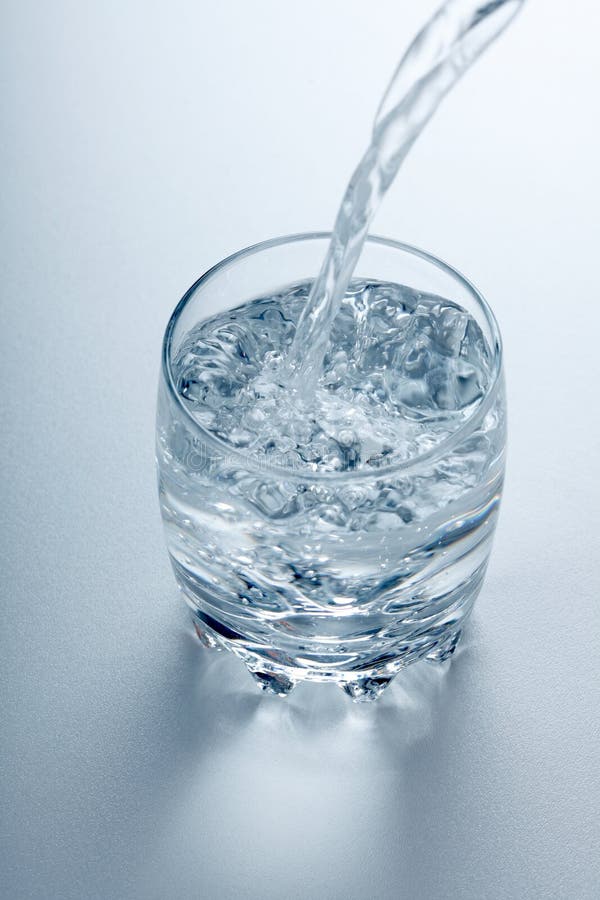 Water flowing into glass stock photo. Image of water - 29609800