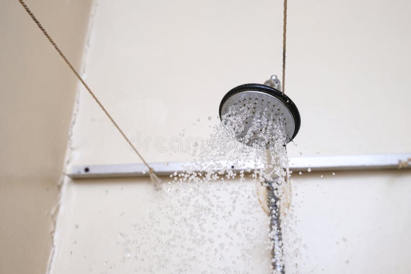 Water Flowing from an Old Shower Head with Ceramic Handle with ...