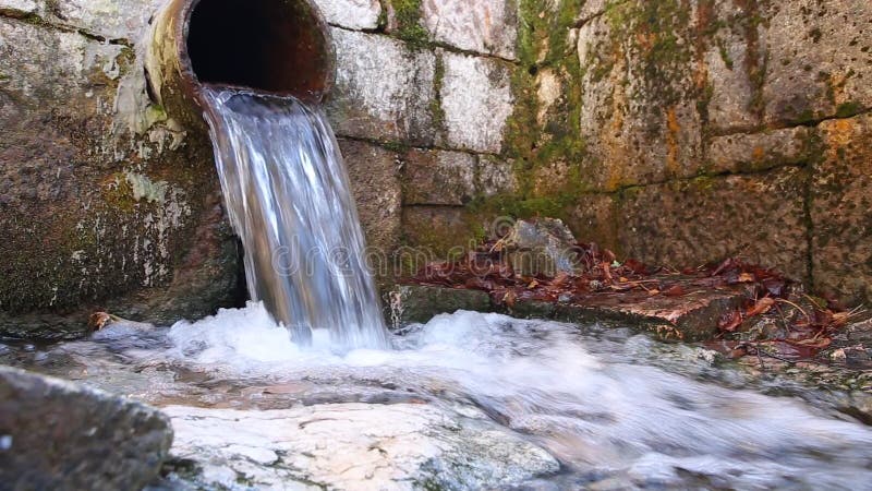Water Flowing Out a Huge Rusty Pipe Stock Footage - Video of factory ...