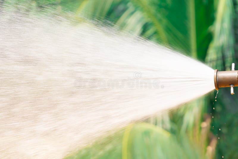 Water flowing out of pipe. stock photo. Image of background - 164286744