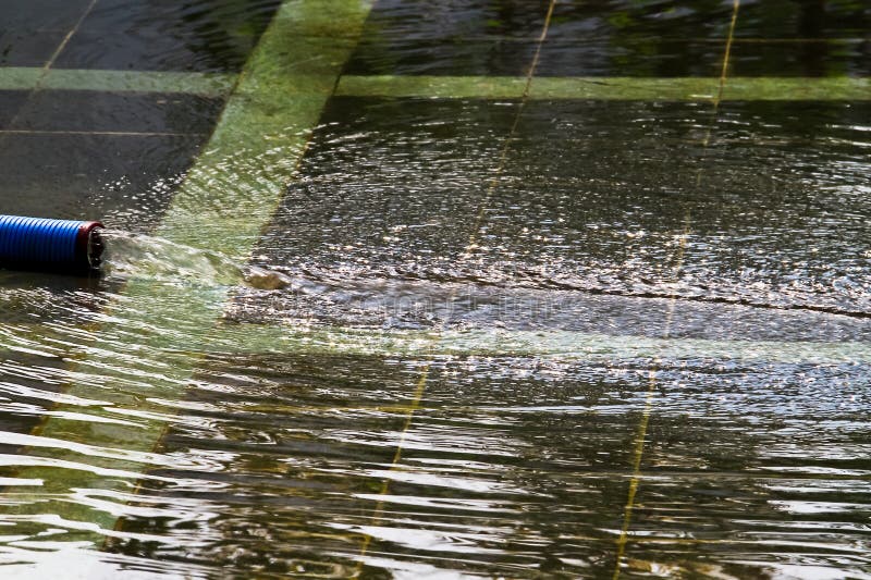 Water Flowing Out of the Pipe Spread on the Concrete Floor Stock Photo ...