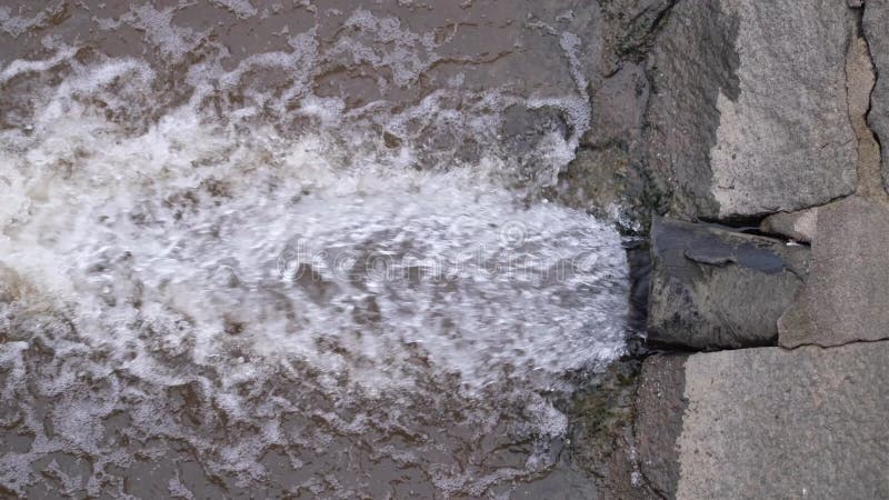Water Flowing into Drainage Grates on Concrete Surface Stock Footage ...