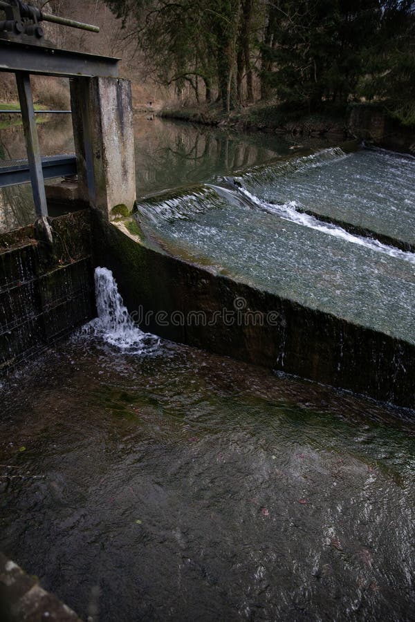 Water Flowing Over a Concrete Weir in a Forest River Setting Stock ...