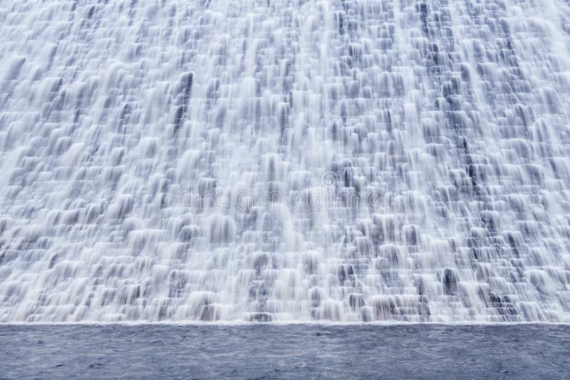Water flowing over a dam stock image. Image of cascade - 173414479