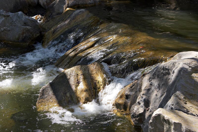 Water Flowing Over Rocks stock photo. Image of cascade - 494236