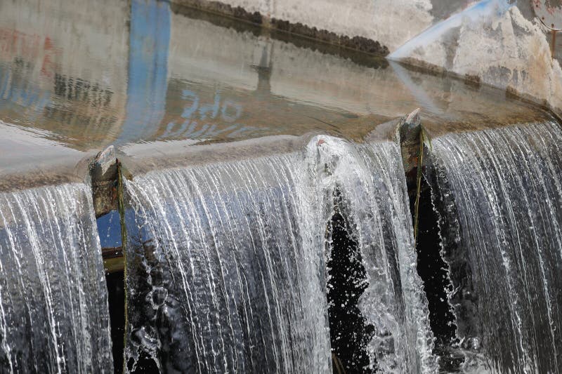 Water Flowing through a Sluice on a Concrete Man Made River Stock Photo ...