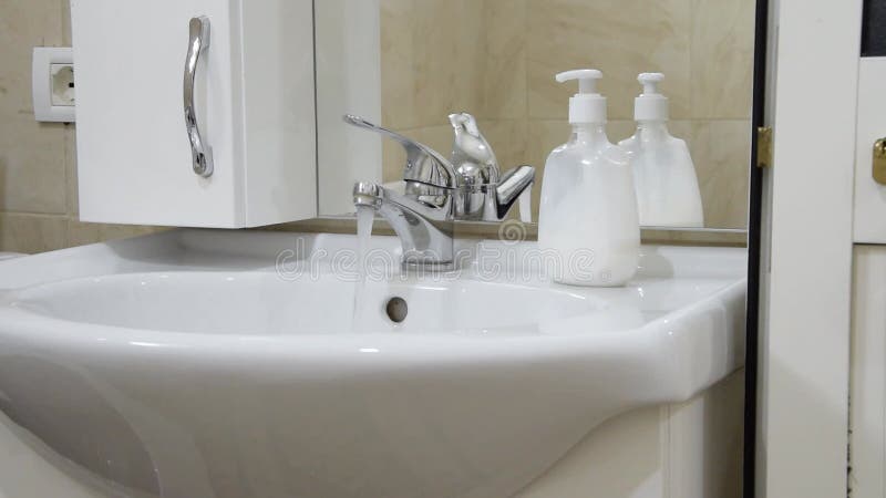 Water Flowing From The Tap In The Bathroom Stock Video Video Of