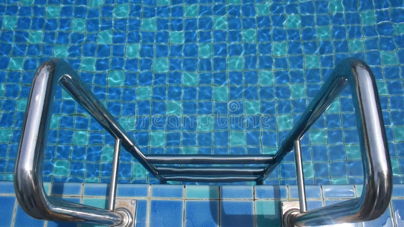 Water Flowing To Edge of Blue Tile Swimming Pool Stock Footage - Video ...