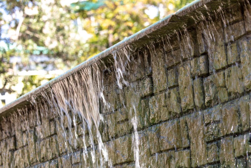 Water Flows Along a Brick Wall Stock Image - Image of garden, grey ...