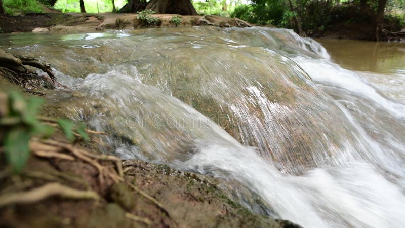 Water Flows through Brown Rocks Down To the River. Stock Video - Video ...